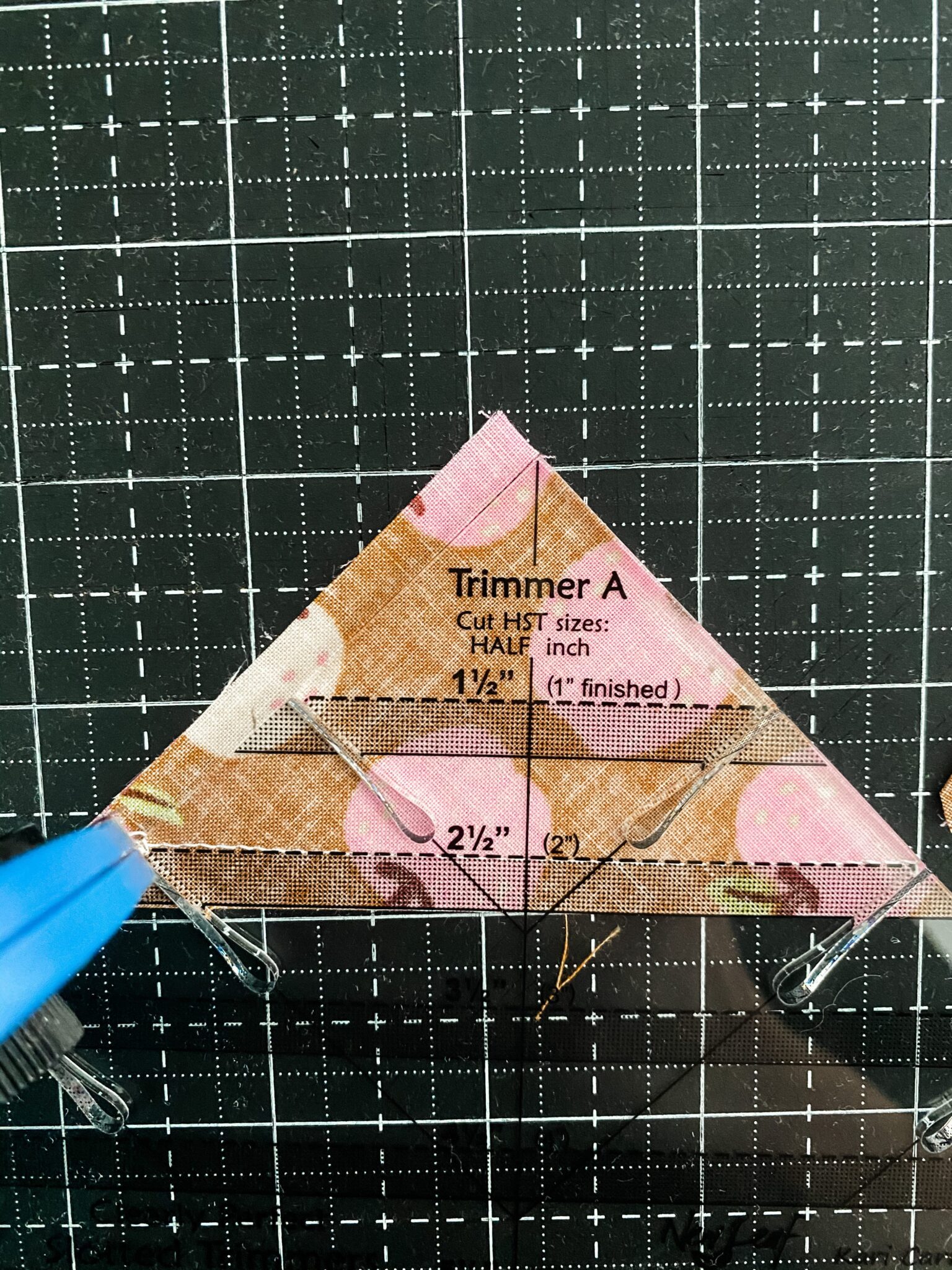 Learn to make perfect Half Square Triangles with this ruler